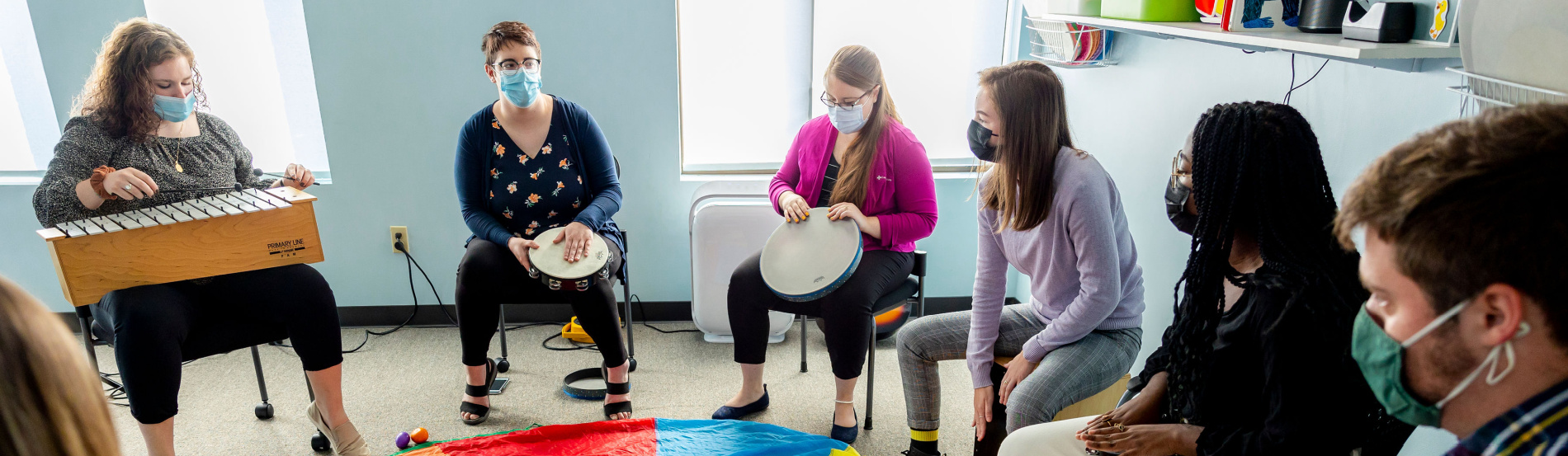 Roman Music Therapy Services Team playing a variety of drums, melodic ...